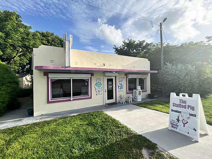 The cheerful pink trim of The Stuffed Pig welcomes hungry travelers like a beacon of breakfast hope along Marathon's Overseas Highway.