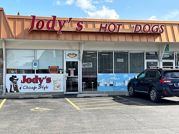 The iconic red lettering of Jody's Hot Dogs stands out against the Joliet sky like a beacon for hungry travelers seeking hot dog nirvana.