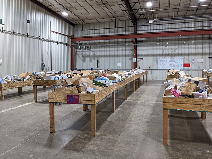 Treasure hunters' paradise! These unassuming wooden bins hold everything from kitchen gadgets to electronics, all waiting to be discovered by savvy shoppers with a keen eye.