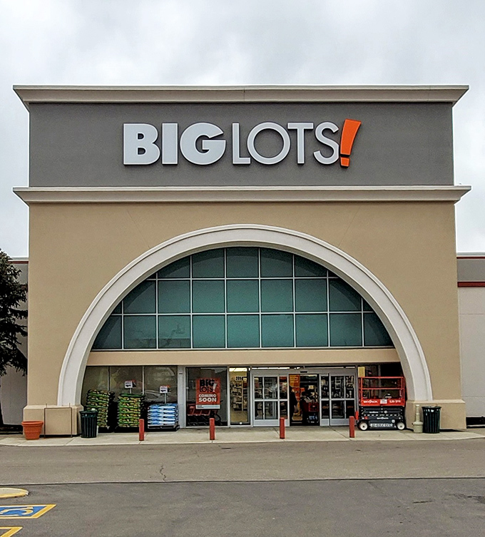 The iconic Big Lots storefront in Kettering beckons with its distinctive arched entrance&mdash;like a cathedral dedicated to the religion of savings.