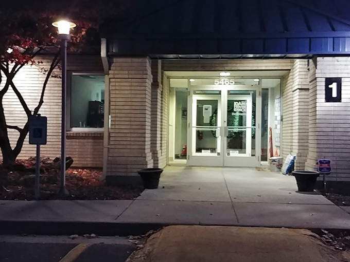 Night or day, this entrance beckons bargain hunters with the quiet confidence of a place that knows its worth.