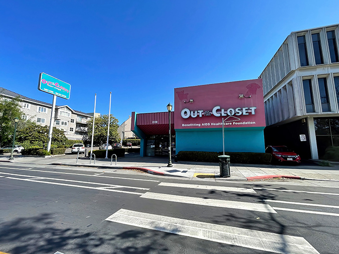 The pink and turquoise facade of Out of the Closet stands out like a fashionable flamingo in Oakland's urban landscape.