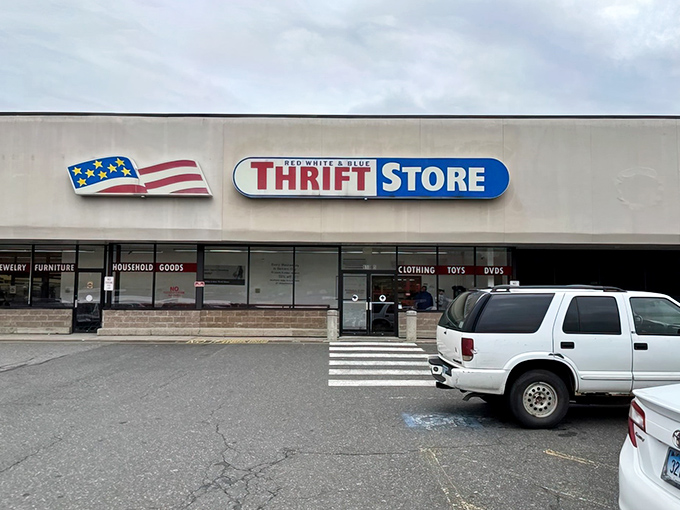 The patriotic facade promises treasure hunting adventures within. Like a retail archaeological dig where the artifacts cost less than your morning coffee.