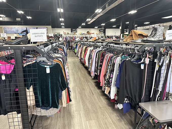 Rows upon rows of neatly organized clothing await treasure hunters at Tampa Thrift. It's like a fashion library where every item tells a different story.