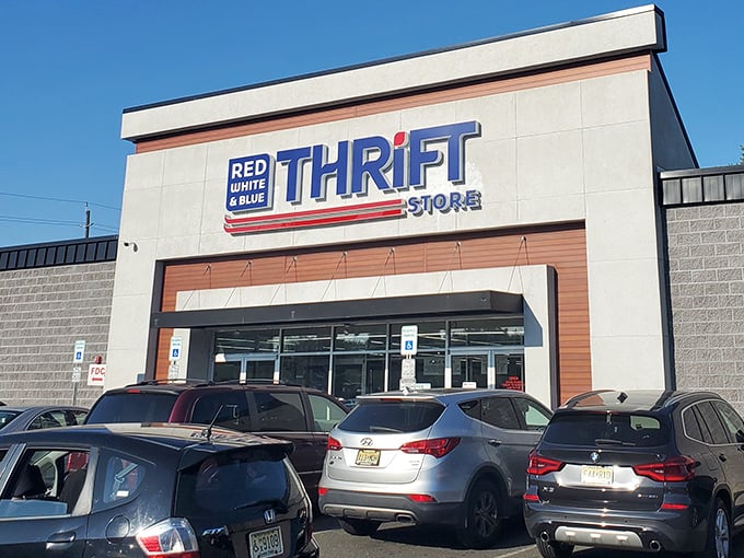 The patriotic facade of Red White & Blue Thrift Store beckons bargain hunters with its bold signage and promise of treasures within.