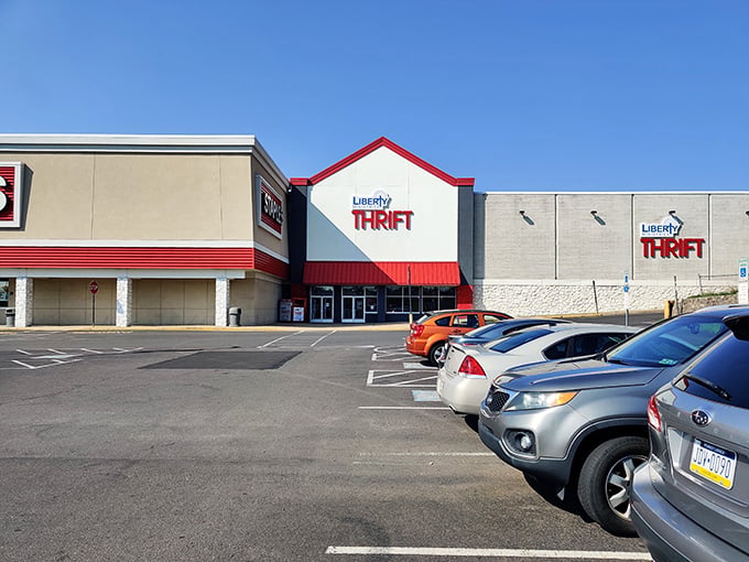 The distinctive red-trimmed facade of Liberty Ministries Thrift stands like a beacon of bargain possibilities under Pennsylvania's blue skies.