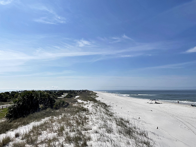 Miles of pristine shoreline stretch before you like nature's welcome mat. This panoramic view of St. Joseph Peninsula's sugary white beaches promises solitude in abundance.