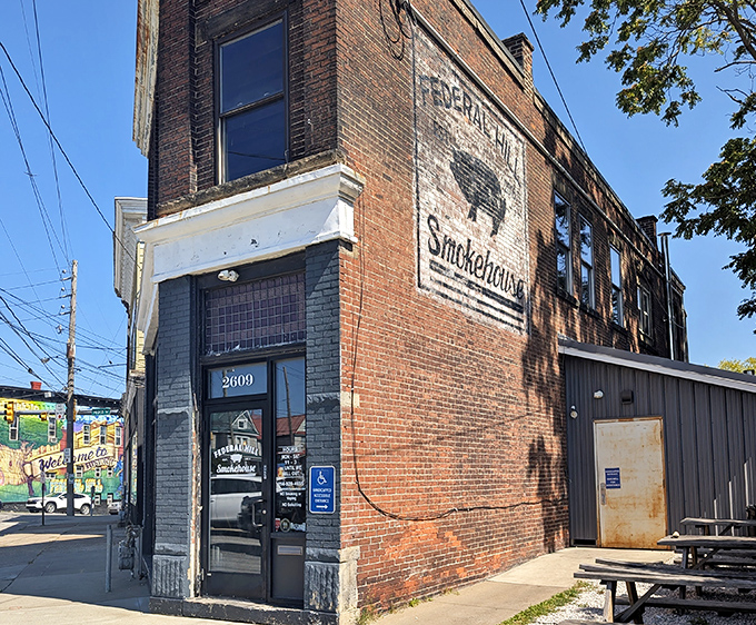 The brick fortress of flavor stands proudly on Peach Street, its weathered sign promising smoky treasures within. A barbecue beacon in Erie's urban landscape.