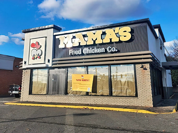 The cheerful chicken logo winks at passersby, a beacon of comfort food promise. Mama's bold yellow signage practically dares you to drive past without stopping.