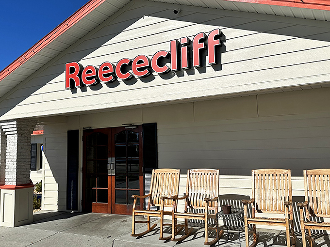 The iconic red Reececliff sign welcomes hungry travelers like a beacon of comfort food hope. Those rocking chairs aren't just for show&mdash;they're for post-biscuit recovery.