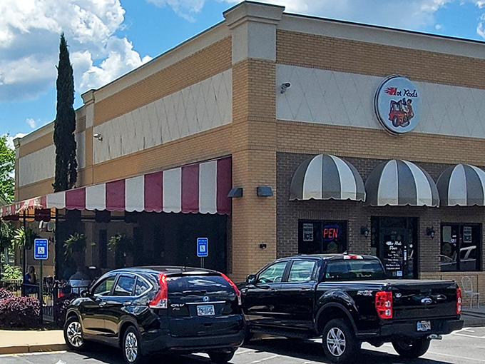 Classic Americana beckons from the roadside with those iconic red and white awnings—like a time machine disguised as a brick building.