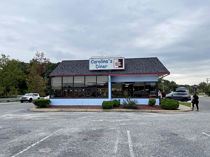 The blue-trimmed exterior of Carolina's Diner stands like a time capsule of Americana, promising comfort food treasures within its unassuming walls.