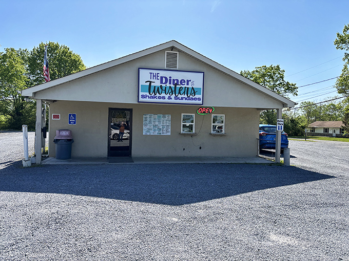 Like finding a $20 bill in old jeans, this roadside gem delivers unexpected joy with its simple facade and neon "OPEN" sign beckoning hungry travelers.