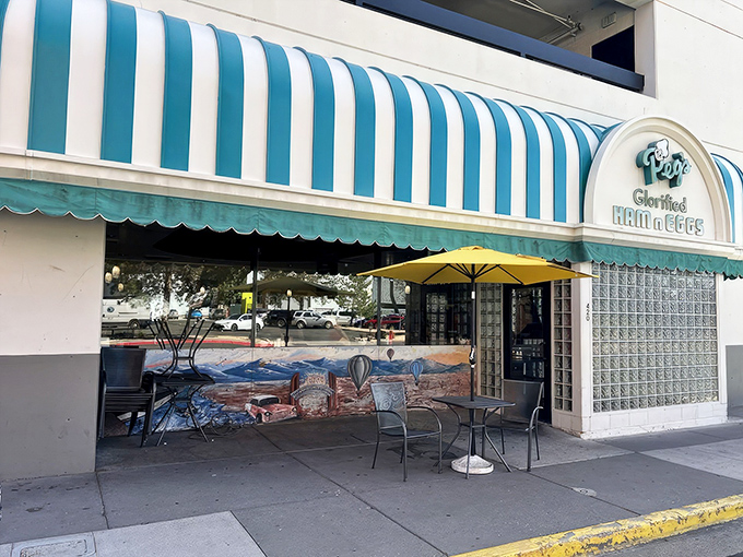 That iconic blue and white striped awning isn't just eye-catching&mdash;it's a beacon of breakfast hope for hungry Reno locals seeking morning salvation.