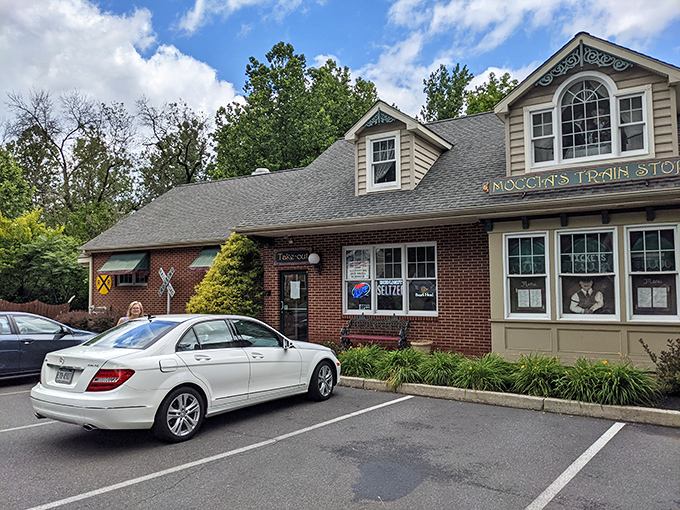 Moccia's welcoming fa&ccedil;ade proudly displays its name above the entrance. That railroad crossing sign isn't just decoration&mdash;it's your first clue to the delightful theme waiting inside.