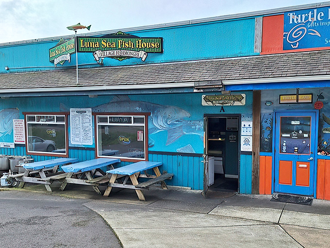 The turquoise beacon of seafood salvation! Luna Sea's exterior promises coastal charm with its vibrant blue walls and whimsical fish murals.