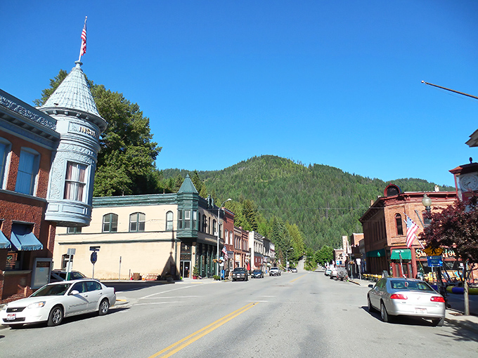 Wallace's historic main street showcases Victorian architecture and turquoise turrets, all embraced by Idaho's lush mountain backdrop.