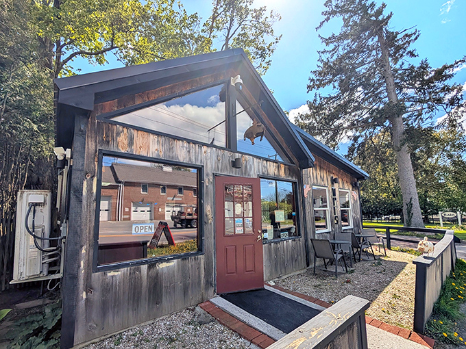 The rustic wooden exterior of When Pigs Fly isn't trying to impress you—it's saving all that energy for what's happening in the smokers out back.
