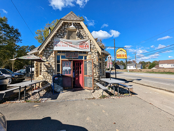The stone fortress of flavor stands proudly on Old Monroe Road, its A-frame design practically whispering "come inside for barbecue magic" to passing cars.