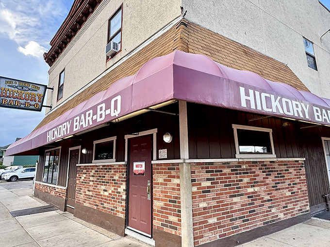 The burgundy awning of Hickory Bar-B-Q stands like a beacon of smoky promise on this Dayton corner, where culinary magic has been happening since long before food bloggers existed.