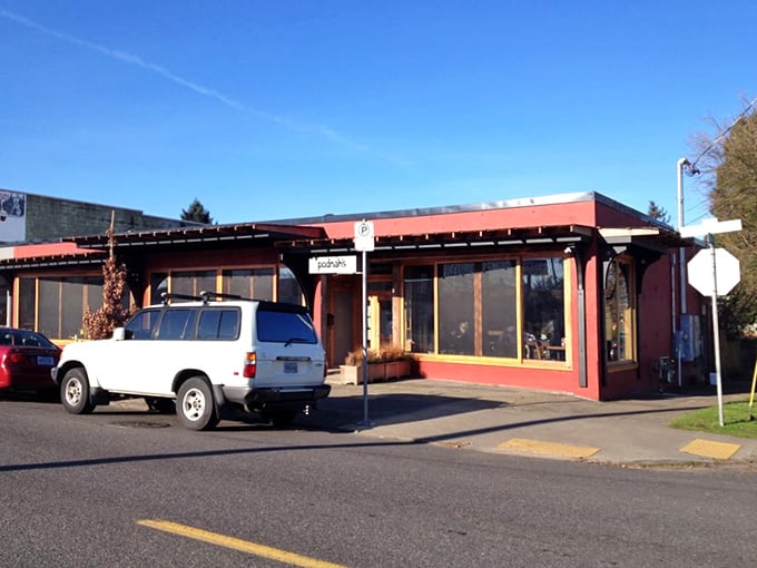 The entrance to barbecue paradise. Those wood stacks flanking the door aren't decorative &ndash; they're the secret behind that intoxicating smoky aroma that greets you.
