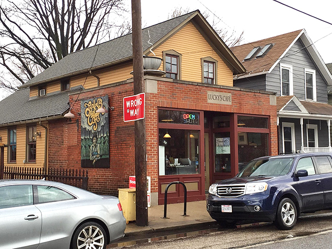 The charming brick-and-yellow exterior of Lucky's Cafe stands like a beacon of breakfast hope in Cleveland's Tremont neighborhood.