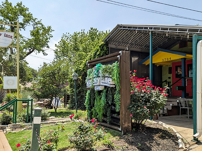 The little yellow house with the red door beckons like a breakfast beacon in Austin's urban landscape.