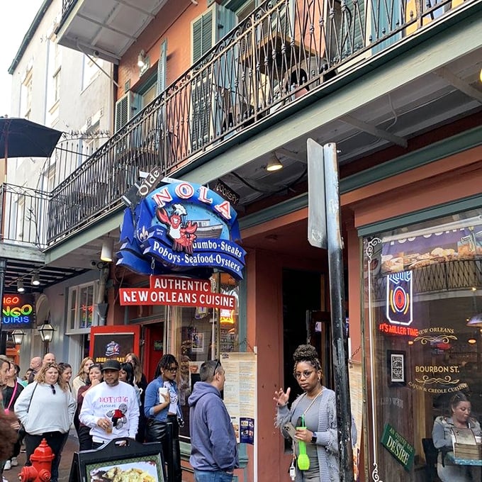 That iconic blue and red sign with the jaunty crawfish isn't just decoration&mdash;it's a beacon guiding hungry souls to seafood salvation on Bourbon Street.
