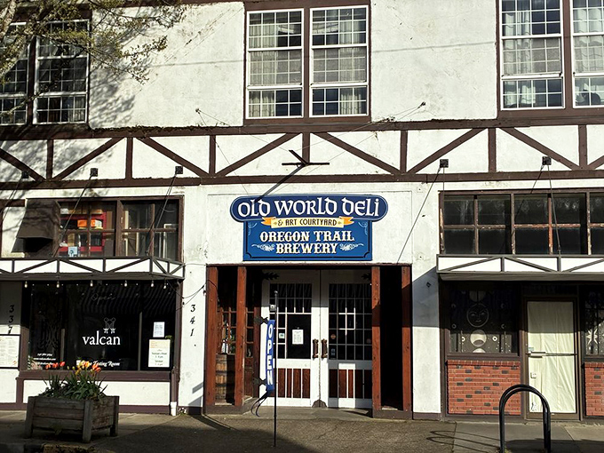 The Tudor-style facade of Old World Deli stands proudly in downtown Corvallis, promising old-world charm before you even step through the door.