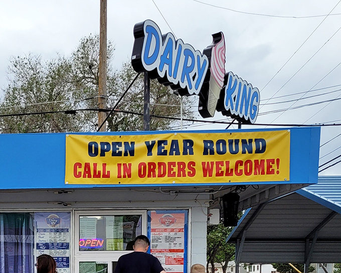 The bright blue Dairy King sign shines proudly in Scottsbluff, offering year-round comfort food that brings summer vibes to even the coldest days.