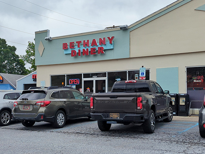 The unassuming blue exterior of Bethany Diner hides culinary treasures within, like a delicious secret waiting to be discovered by hungry beachgoers.