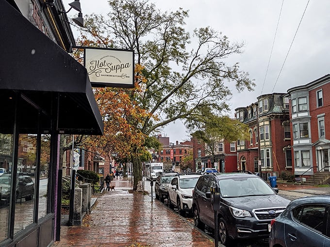 Even on a rainy Portland day, Hot Suppa's welcoming sign promises comfort food that makes weather woes disappear faster than pancakes at a lumberjack convention.