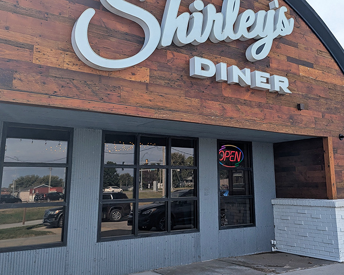 That classic wooden exterior with the glowing "OPEN" sign—the universal symbol for "comfort food awaits within."