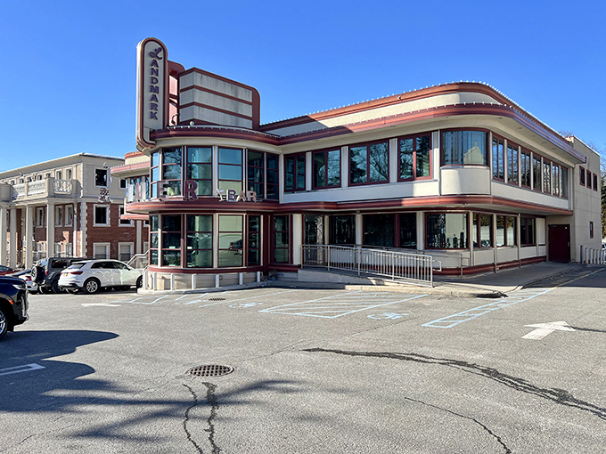 The gleaming Art Deco curves of Landmark Diner stand proudly against the sky, like a chrome-trimmed time machine ready to transport you to breakfast nirvana.