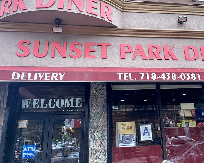 The iconic red lettering of Sunset Park Diner beckons like an old friend, promising comfort food that never goes out of style.