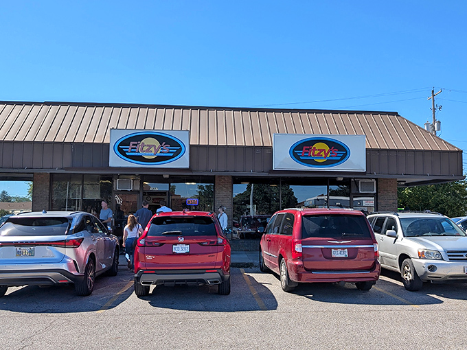 The unassuming exterior of Fitzy's beckons with its blue oval signs&mdash;proof that culinary treasures often hide in plain sight.