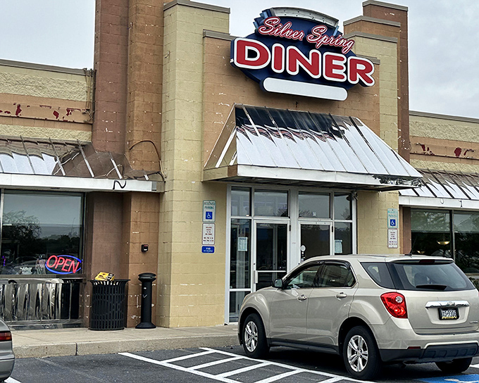 The classic diner exterior beckons with its neon glow, promising comfort food that'll make your taste buds do a happy dance.