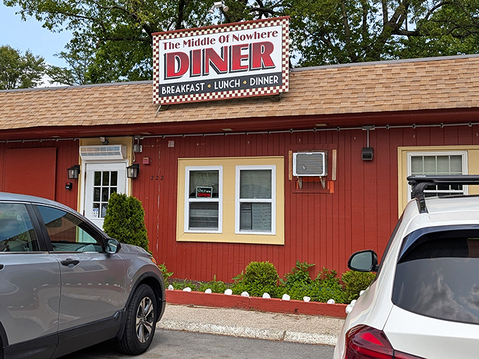 Truth in advertising at its finest! The cheerful red exterior with its classic checkered sign promises comfort food salvation for hungry travelers on Route 3.
