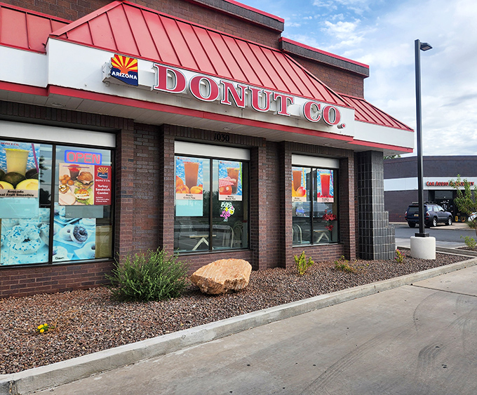 The iconic red-trimmed roof of Arizona Donut Co. stands out like a beacon of breakfast hope in this Tempe strip mall.
