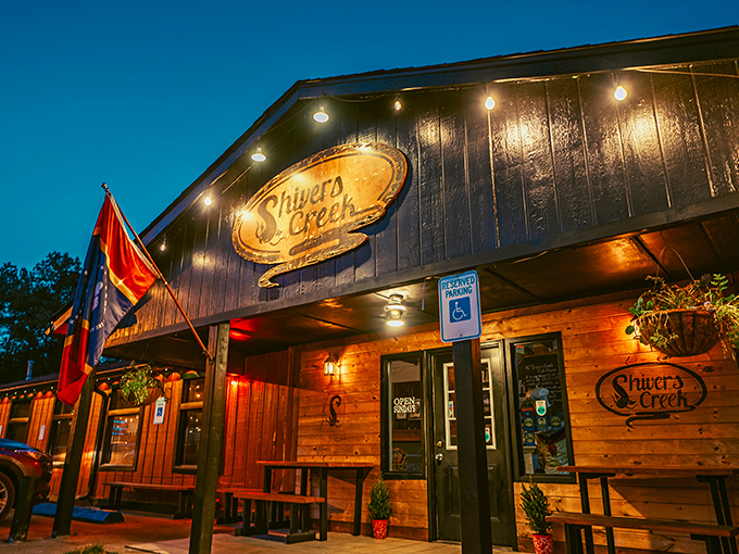 The red wooden exterior shines warmly at dusk, inviting guests in for Southern comfort and delicious catfish delights.