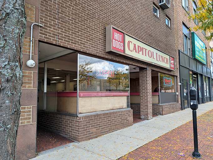 The unassuming brick fa&ccedil;ade of Capitol Lunch stands like a culinary lighthouse on New Britain's Main Street, beckoning hungry travelers with its simple promise: hot dogs and happiness.
