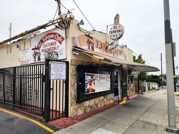 The unassuming stone facade of El Tepeyac stands like a culinary lighthouse in Boyle Heights, beckoning hungry souls with its iconic vintage sign.