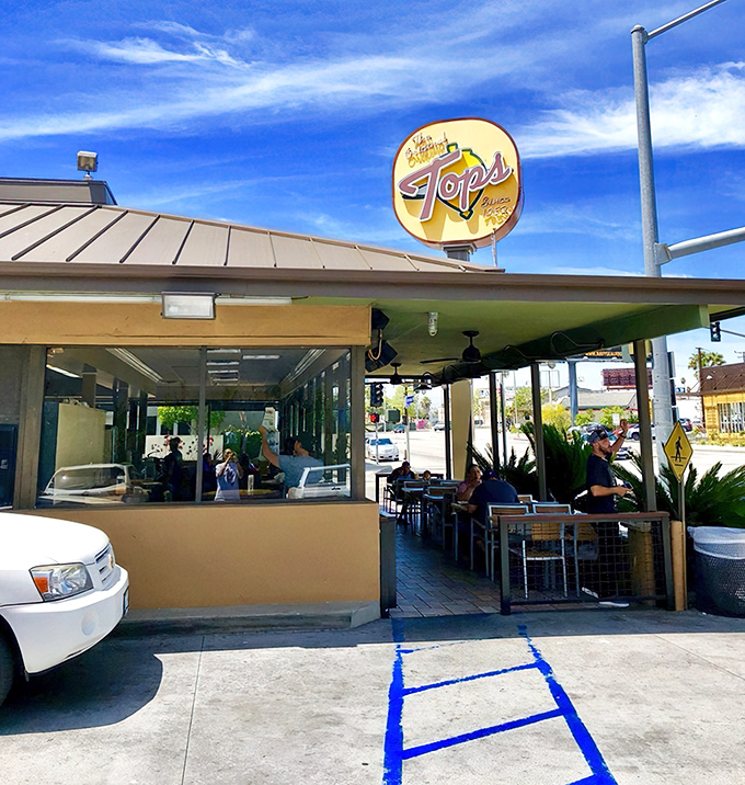 The iconic yellow sign beckons like a burger lighthouse on Colorado Boulevard, promising no-frills deliciousness to Pasadena's hungry masses.