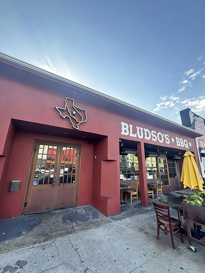 The vibrant red exterior with its Texas state outline logo announces you've arrived at the promised land of smoke and spice.