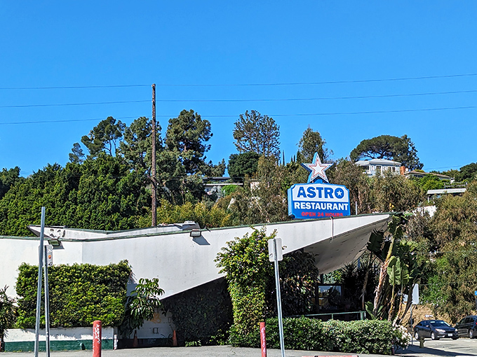 Bathed in golden California sunshine, Astro's distinctive architectural silhouette stands out against the hillside like a delicious mirage promising pancakes at any hour.
