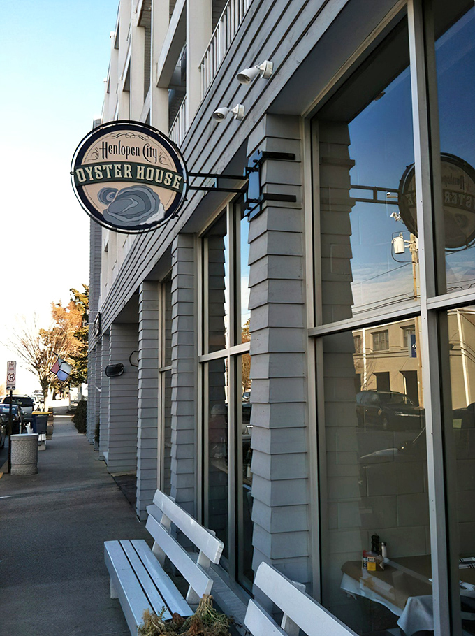 That iconic circular sign promises oceanic treasures within&mdash;like a wax seal on an invitation to the best party in town.