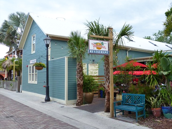 The teal-colored charm of The Floridian beckons from its historic St. Augustine street corner, where palm trees stand guard like culinary sentinels.