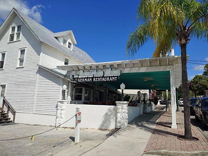 A slice of Bavaria hiding in plain sight! The Bavarian Haus's charming white exterior and covered patio invite you to experience German cuisine under Florida palms.