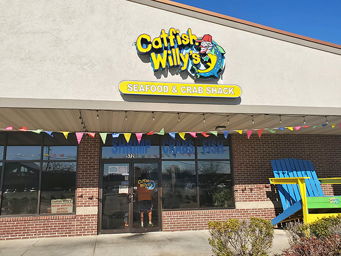 The cheerful winking catfish logo promises a seafood adventure that delivers far beyond its unassuming strip mall location.