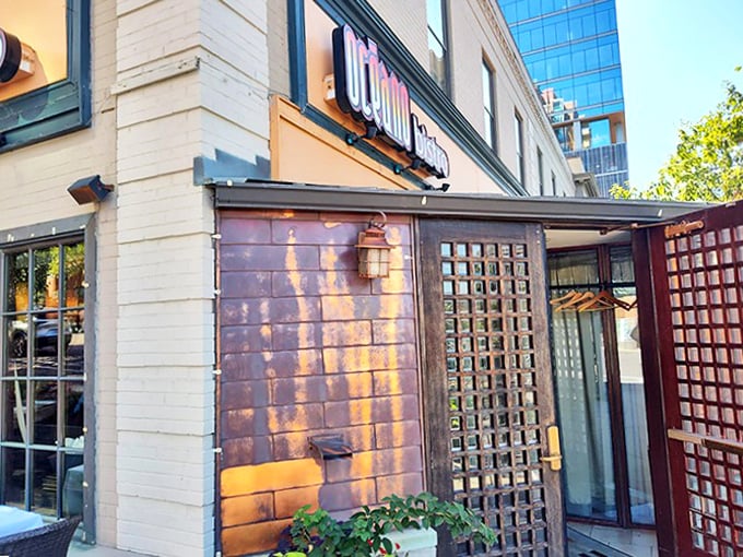 The copper-toned exterior glows at sunset, transforming this Clayton seafood haven into a beacon for hungry travelers seeking coastal flavors in the Midwest.